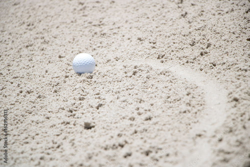 Golf Ball in Sand Trap Stock Photo | Adobe Stock