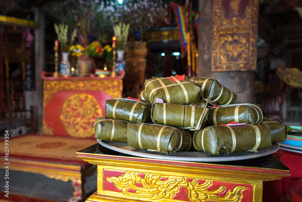 Chung cake on altar in old village communal house. Cooked square ...