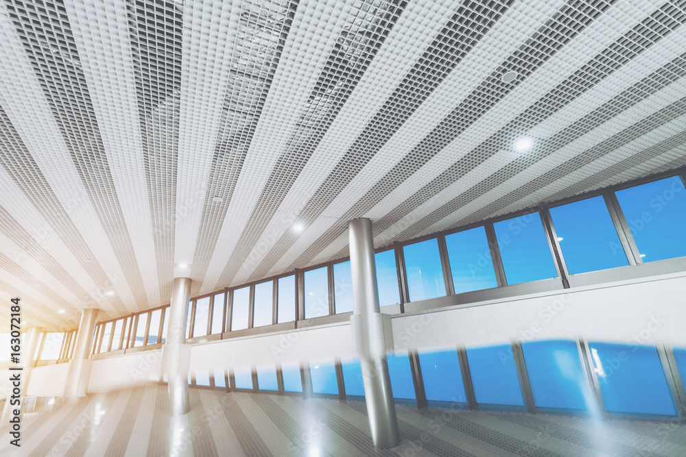 Wide angel view of upper part of bright abstract interior: modern ...