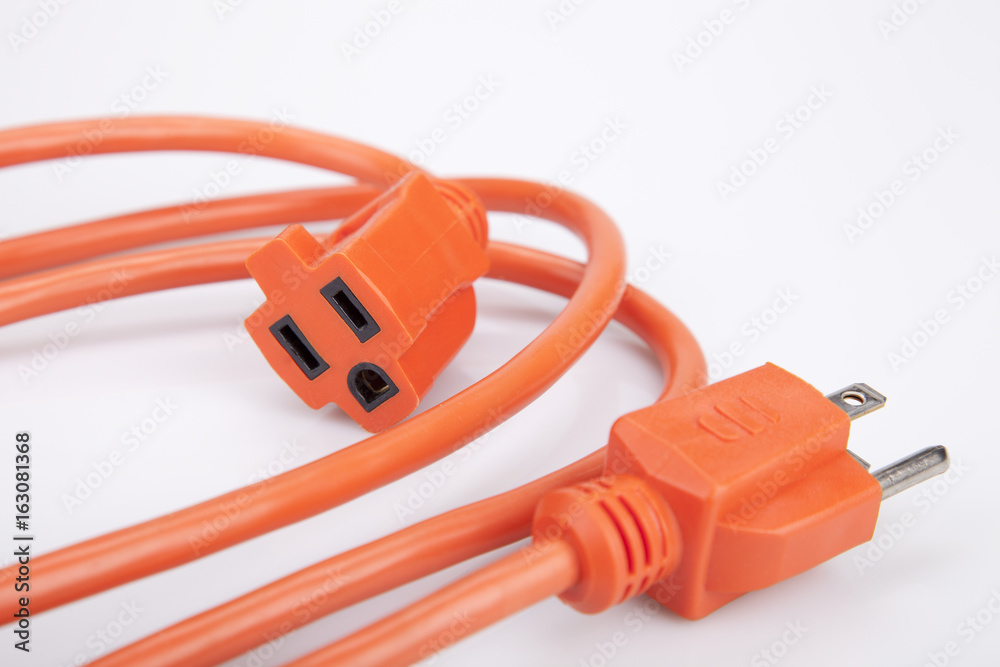 Bright orange extension cord on a white surface. Orange extension cable ...