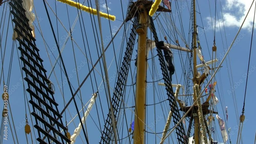 Masts, rigging, banners and pirate flag waving in wind on Indonesian ...