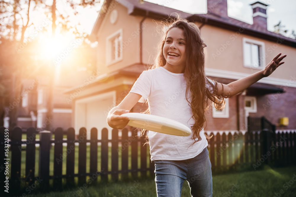 Little girl on backyard Stock Photo | Adobe Stock
