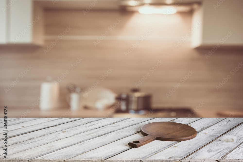 Blurred and abstract kitchen background. Empty wooden tabletop with ...