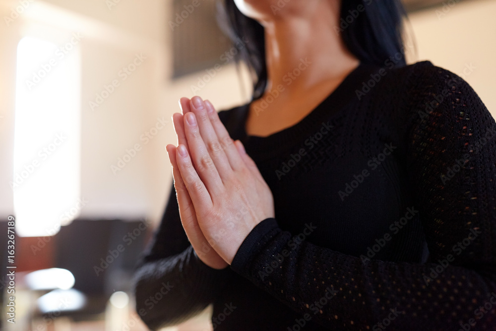 close up of sad woman praying god in church Stock Photo | Adobe Stock