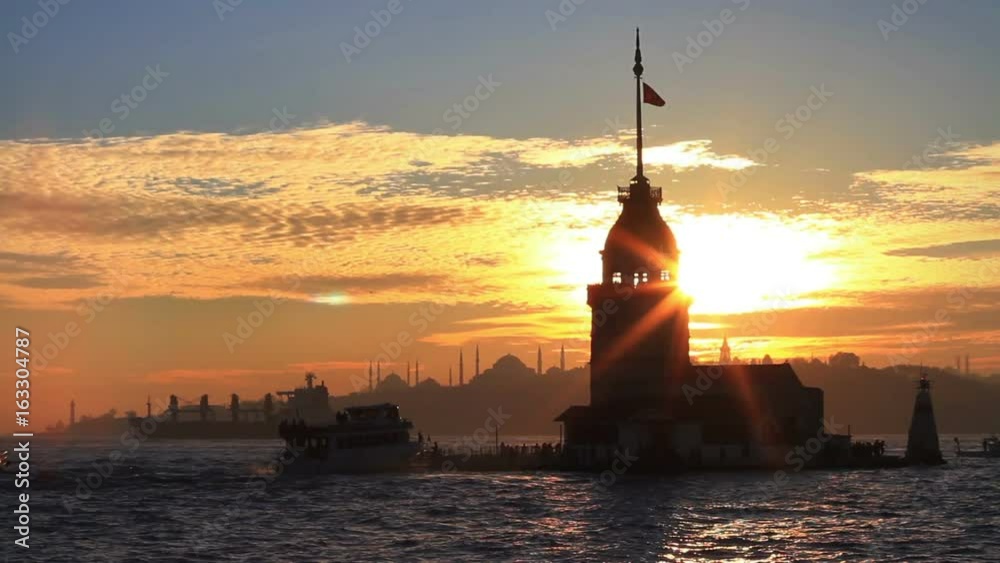 Sunset cityscape with dramatic clouds in orange and yellow color in ...