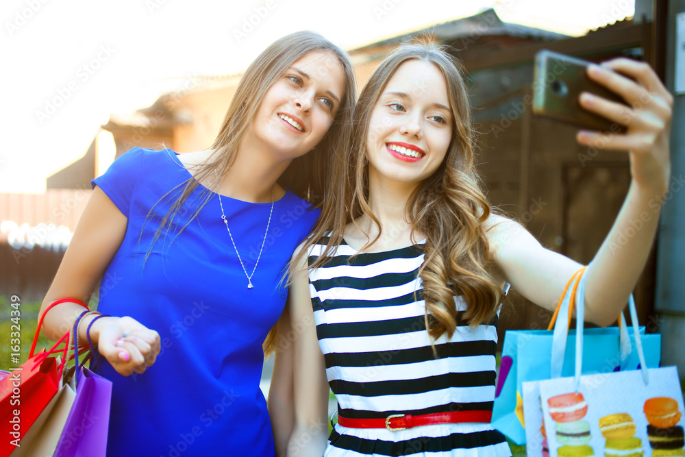 girls with purchases Stock Photo | Adobe Stock