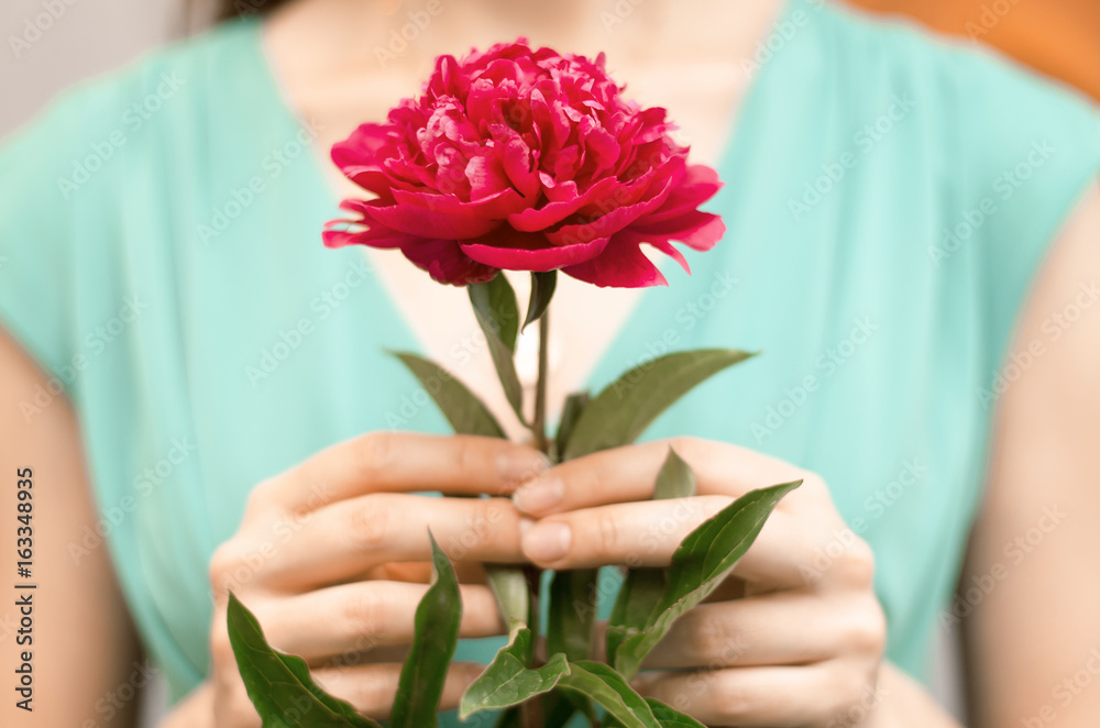 Girl With Flower In Hand