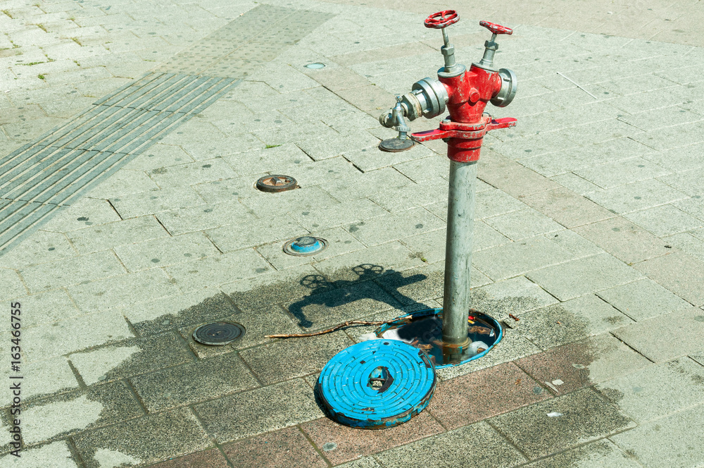 Fire hydrant used like cooling refreshment water supply for hot summer ...
