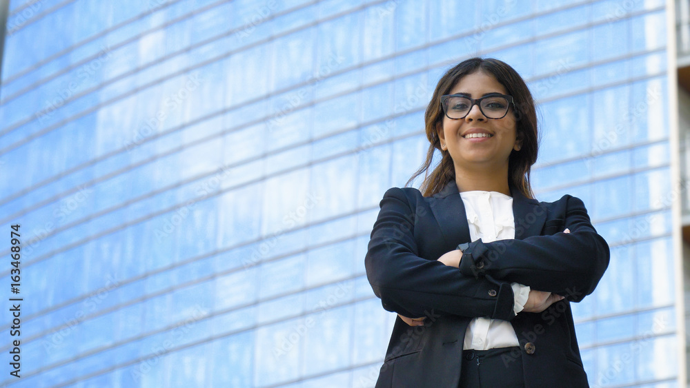 Portrait of young beautiful business woman (student) in suit, glasses ...