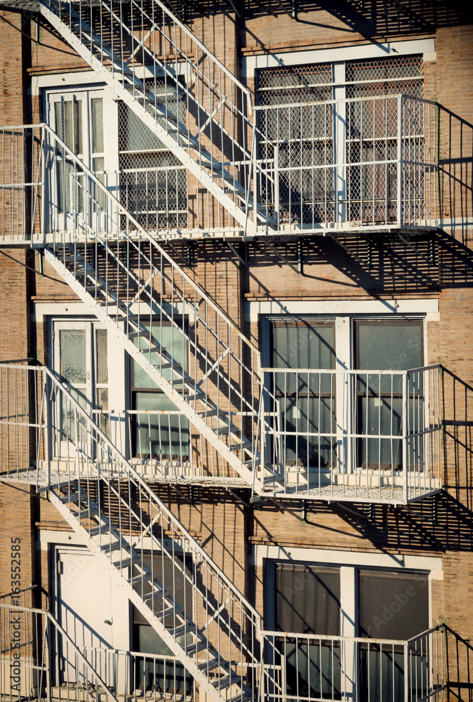 Exterior of a building with old fire escape in New York City Stock ...