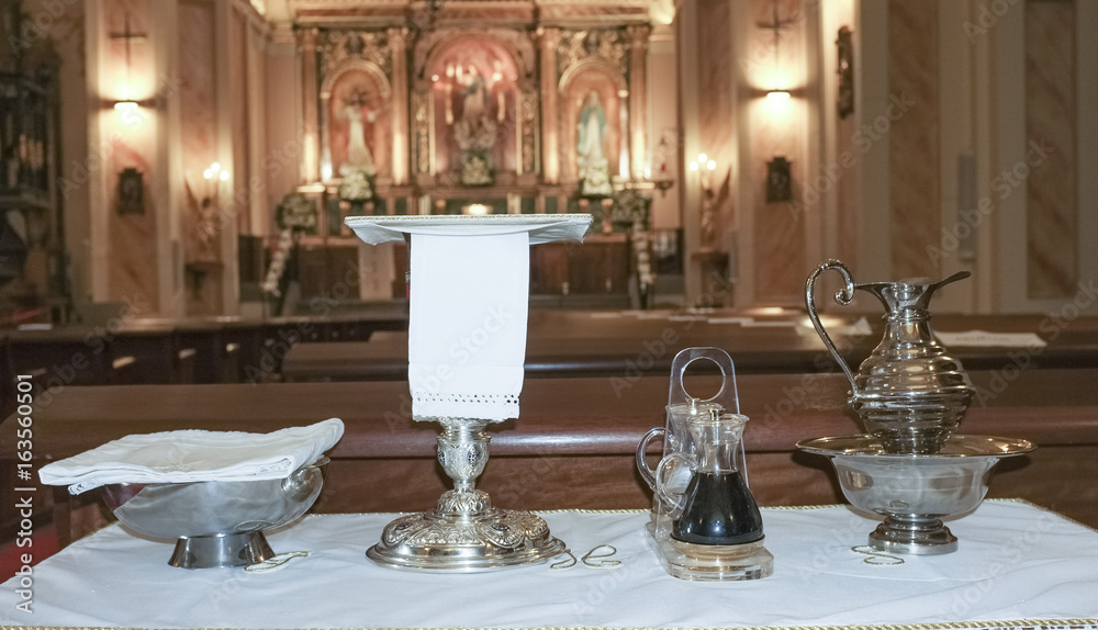 Catholic liturgical object. Chalice, communion wafers, wine, water ...