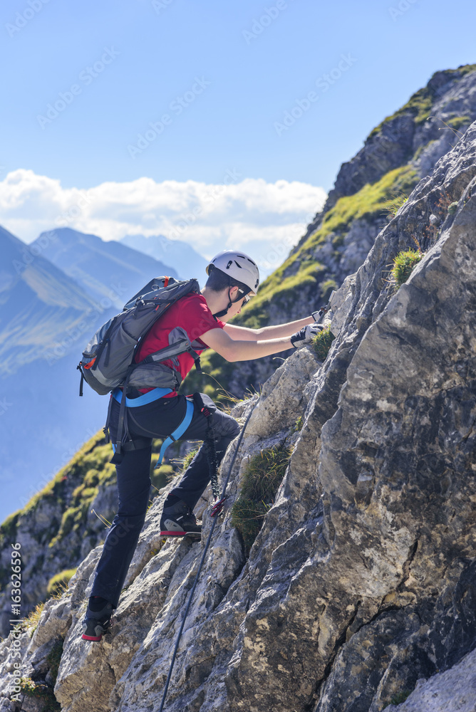 Klettersteig - Bergsteigen im gesicherten Steig Stock-Foto | Adobe Stock