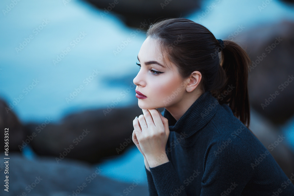 Beautiful young woman. Dramatic outdoor portrait of sensual brunette ...
