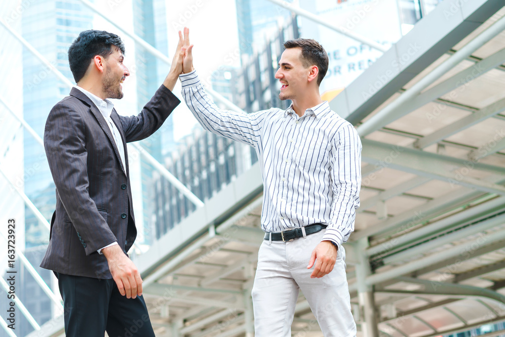 Happy business team making high with clapping their hands in the ...