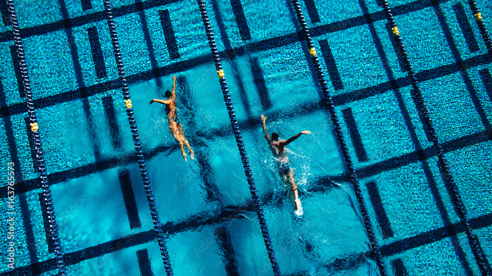 Overhead view of swimmers in pool Stock Photo | Adobe Stock