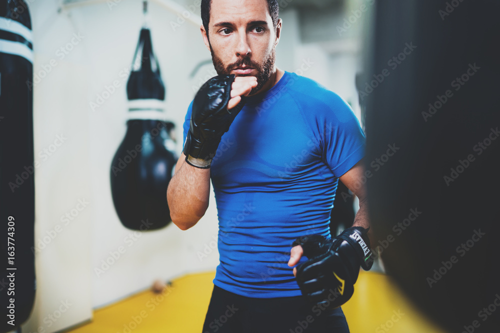 Concept of a healthy lifestyle.Young muscular man fighter practicing ...