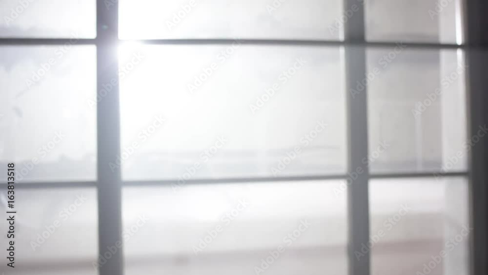 Bright white light outside the window. Spotlight outside the window ...