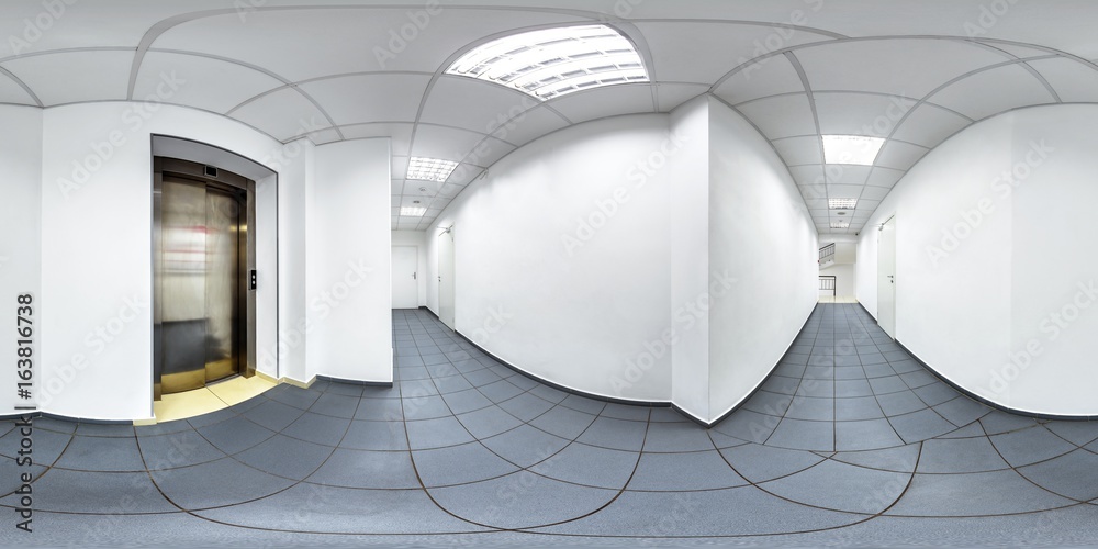 Two long white hallways with elevator lift with blue floor tiles full ...