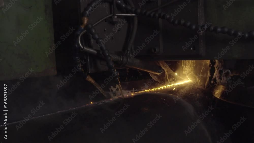 Welder complete with personal protective equipment is perform pipe ...