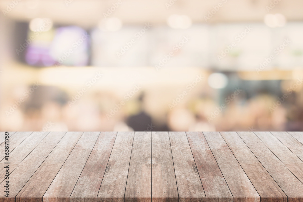 Wood table top and blurred restaurant kitchen interior background - can ...