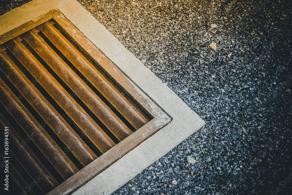 Drain on the street. Water drain on the sidewalk in the asia city for ...