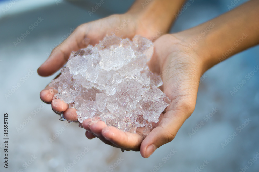 hand holding ice cubes Stock Photo | Adobe Stock