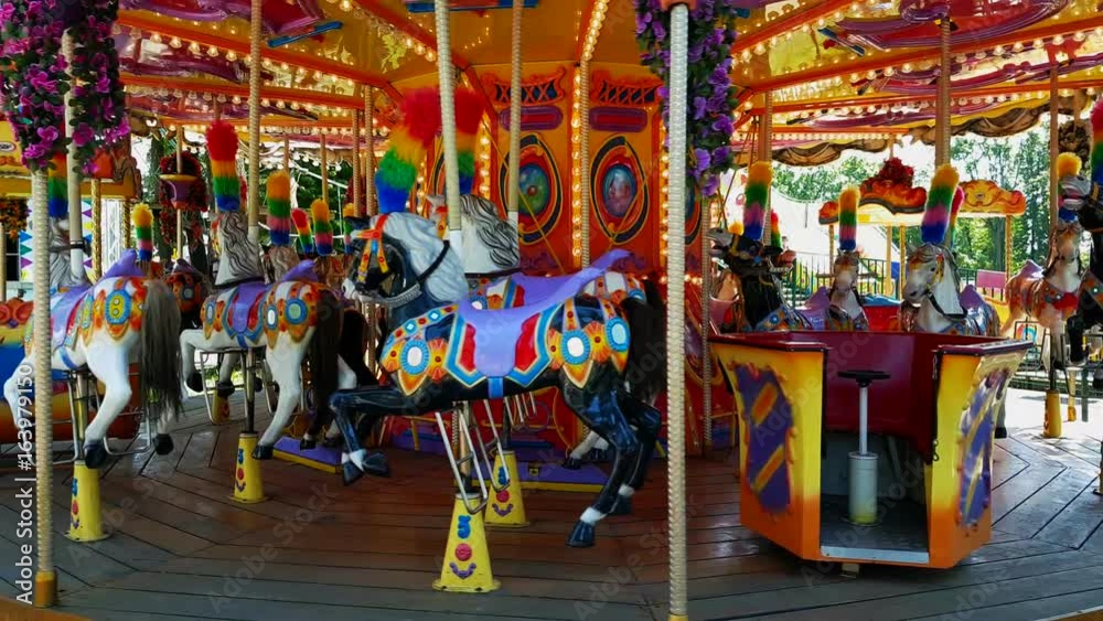 Working merry-go-round carousel in the amusement park. Nobody Stock ...
