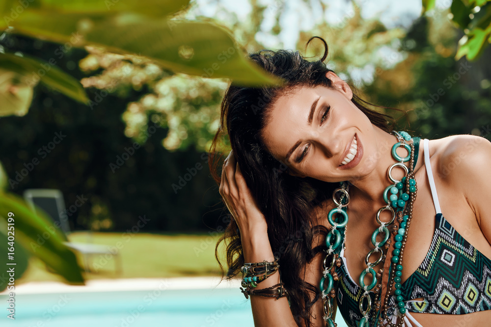 Model Posing Next to Swimming Pool in garden Stock Photo | Adobe Stock