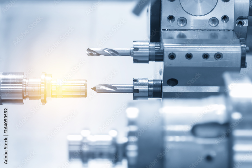 CNC lathe machine or Turning machine drilling the copper rod .Hi ...