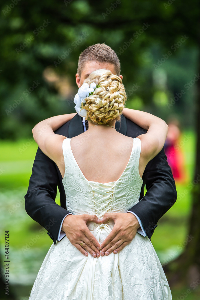 Heart symbol. Hands making love symbol. The bride and groom in nature ...
