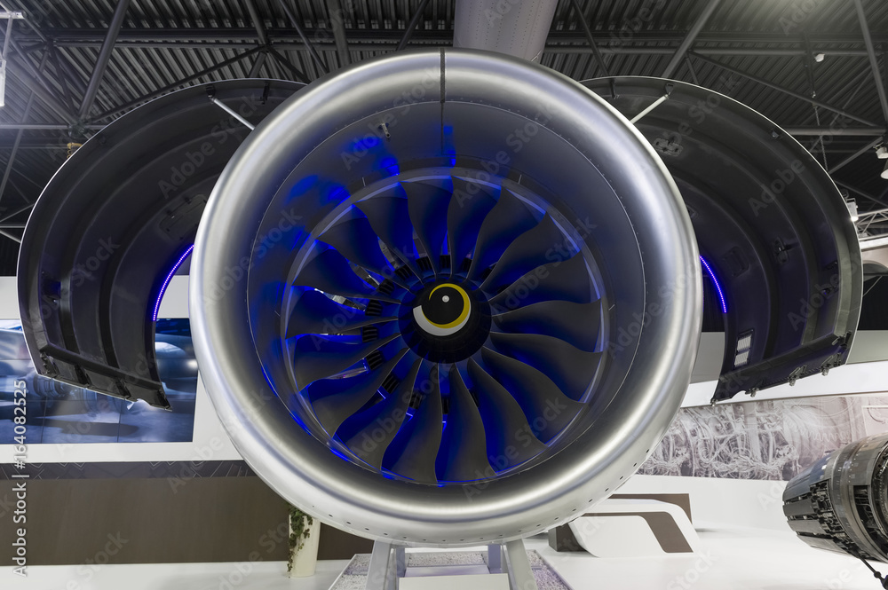 Jet engine with opened hood, turbine blades of modern passenger plane ...