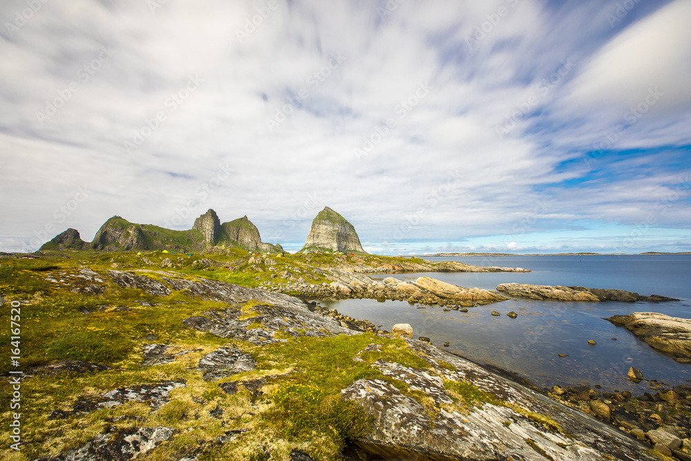 Scandinavian Norwegian landscape with mountains, green grass, rocks ...