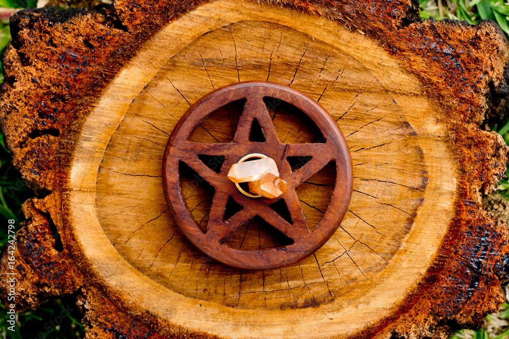 Quartz crystal in centre of wooden pentacle - pentagram on cut timber ...