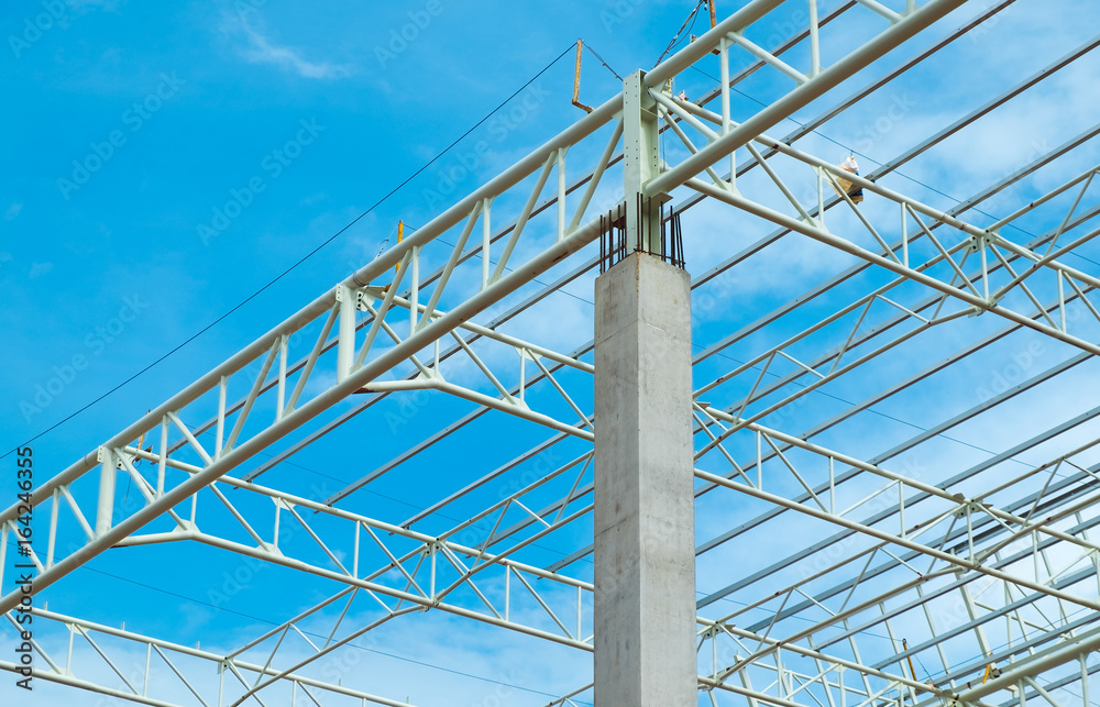Concrete Column And Roof Steel Truss In Construction Site Stock Photo concrete-column-and-roof-steel-truss-in-construction-site-stock-photo
