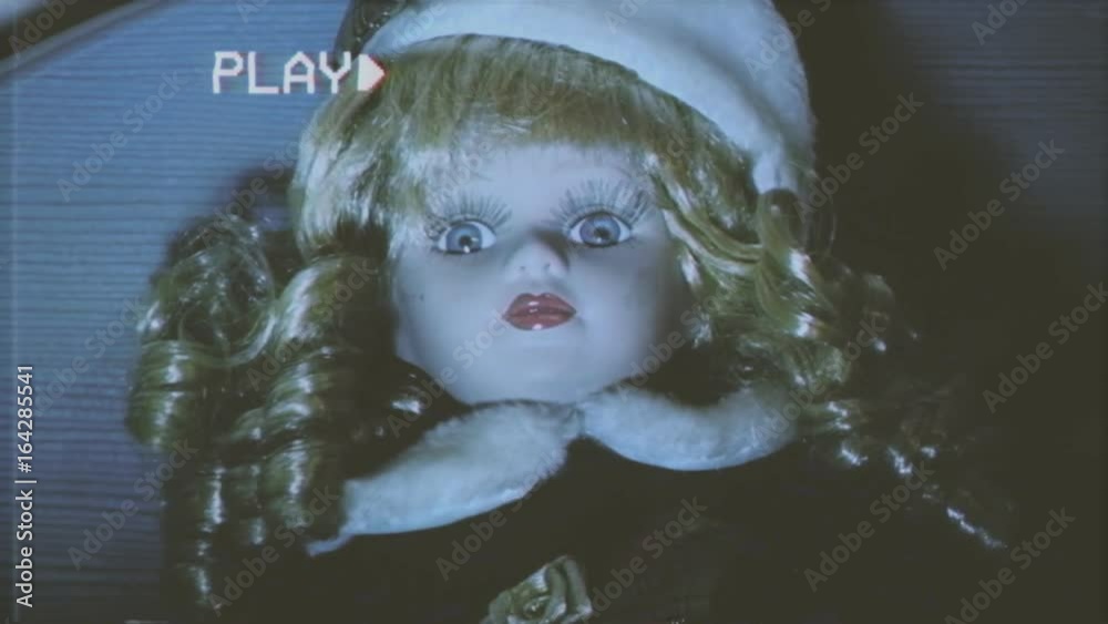 Fake VHS tape: a scary doll on top of a bed, in a bedroom, staring at ...