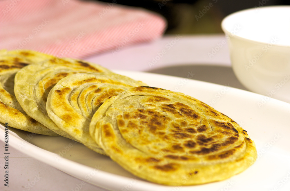 Kerala paratha is a tasty South Indian Dish usually served with a spicy ...