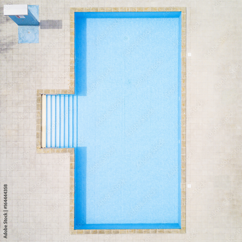 Aerial view of swimming pool with shower outdoors. Beautiful pool with ...