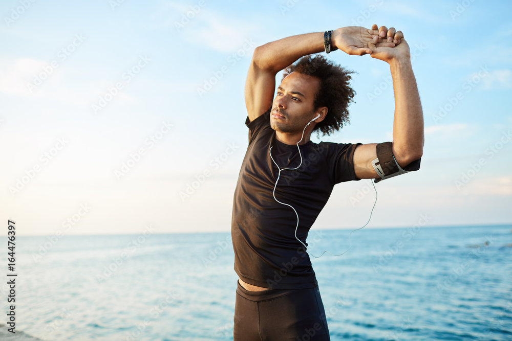 Man runner with bushy hairstyle stretching before active workout. Male ...