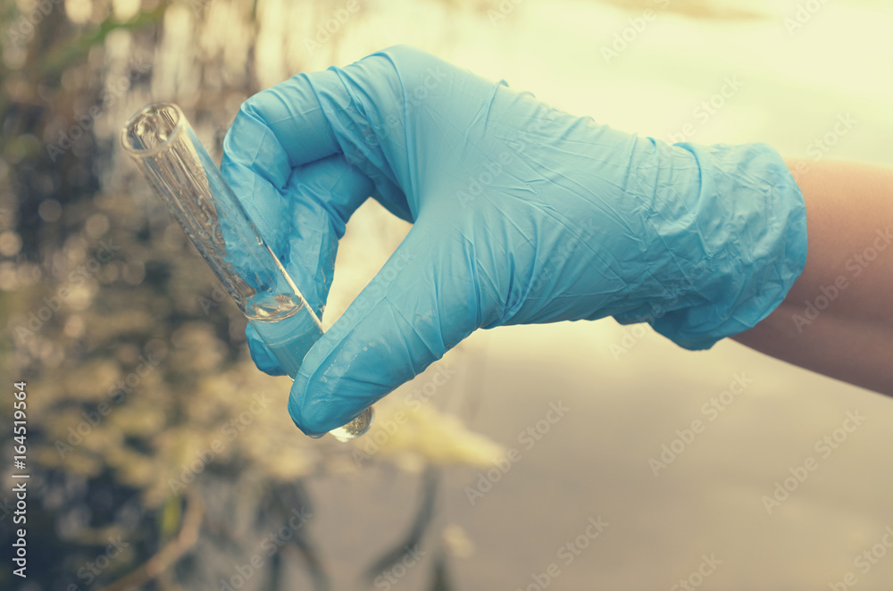 Taking a water test for analysis from a reservoir. Stock Photo | Adobe ...