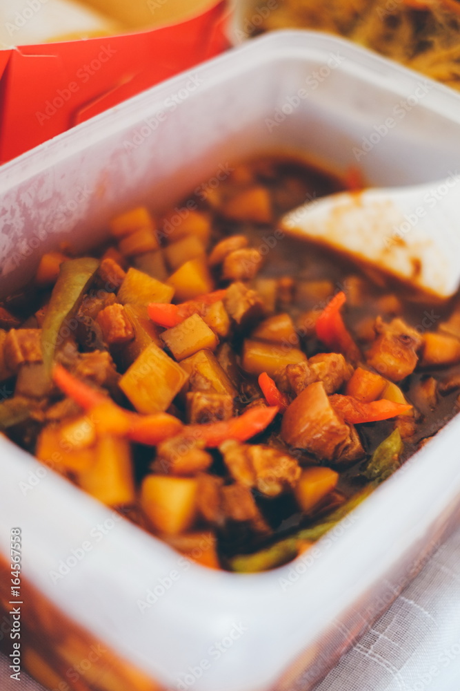 Menudo Filipino food, pork meat and vegetables with tomato sauce ...