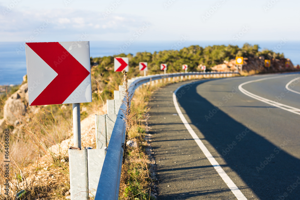 Right Turn Sign: Road signs warn of a sharp turn on a narrow road Stock ...