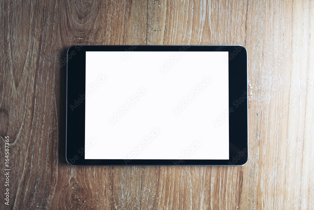 Mockup image of close up black tablet pc with blank white screen on ...