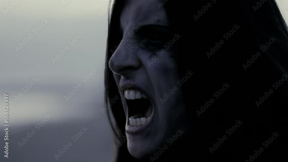 Woman zombie screaming in pain slow motion Stock ビデオ | Adobe Stock