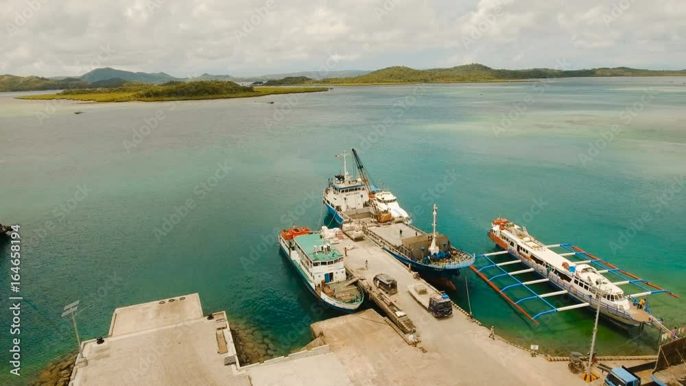 Vídeo do Stock: Cargo and passenger port with barges and cargo ships on ...