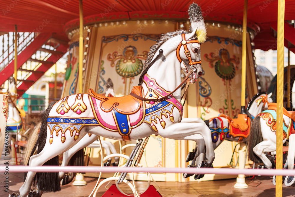 Horses on a carnival Merry Go Round. Old French carousel in a holiday ...