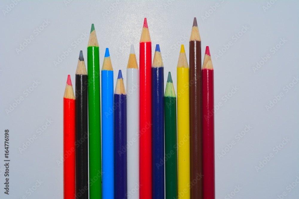 Different colored pencils stacked next to each other portraying ...
