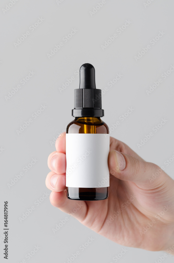 Dropper Bottle Mock-Up. Blank Label - Male hands holding a dropper ...
