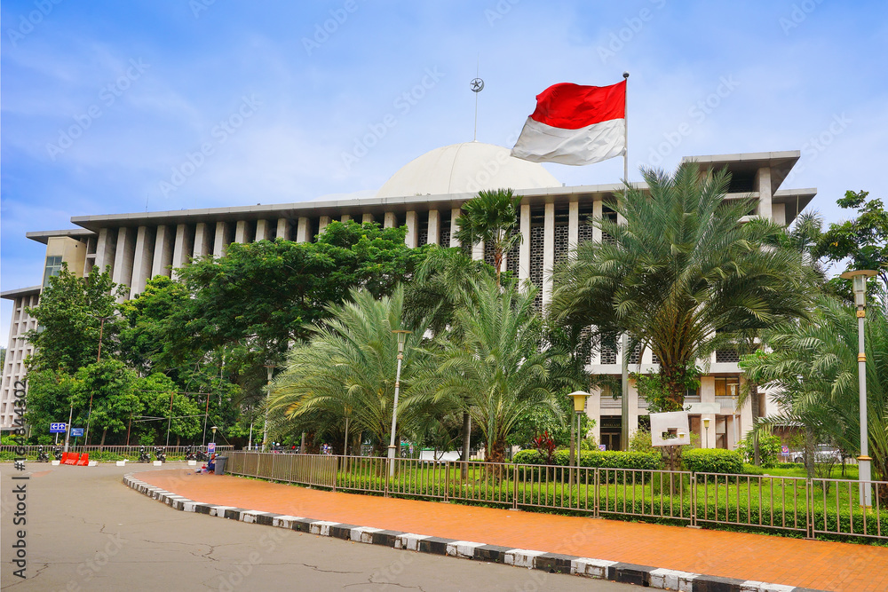 Jakarta view. Istiqlal Mosque with the indonesian flag, the largest ...