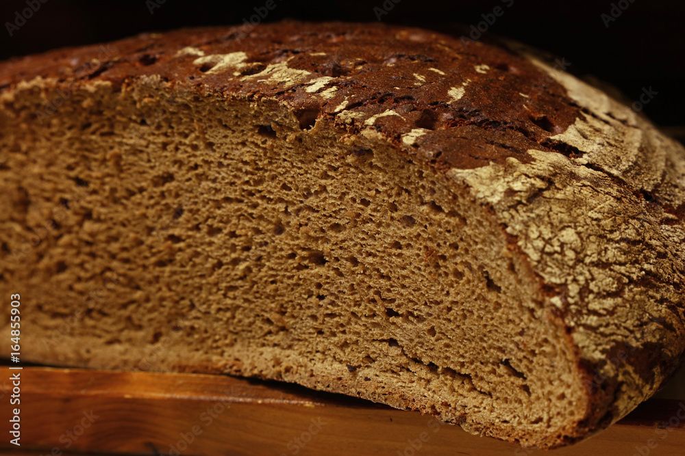 Half of black rye artisan bread loaf Stock Photo | Adobe Stock