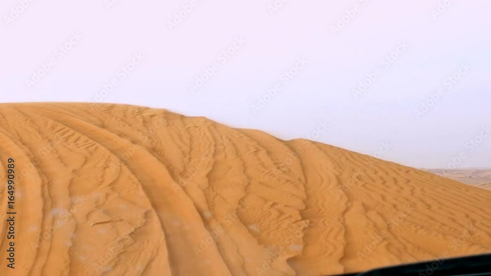 4x4 off road land vehicle taking tourists on desert dune bashing safari ...